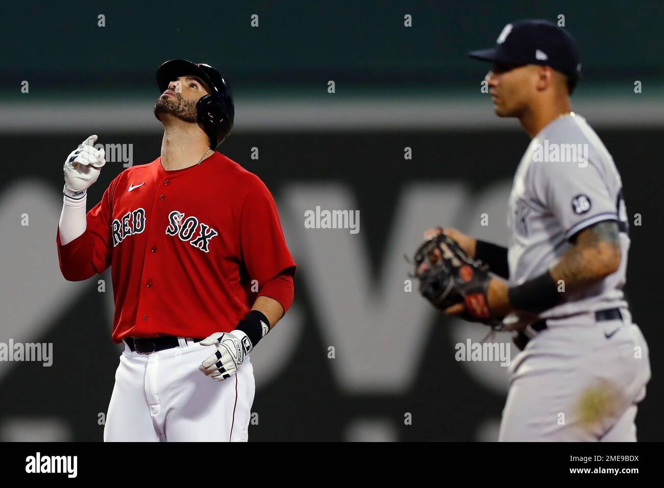 Boston Red Sox's J.D. Martinez, left, reacts beside New York Yankees' Gleyber Torres after ...