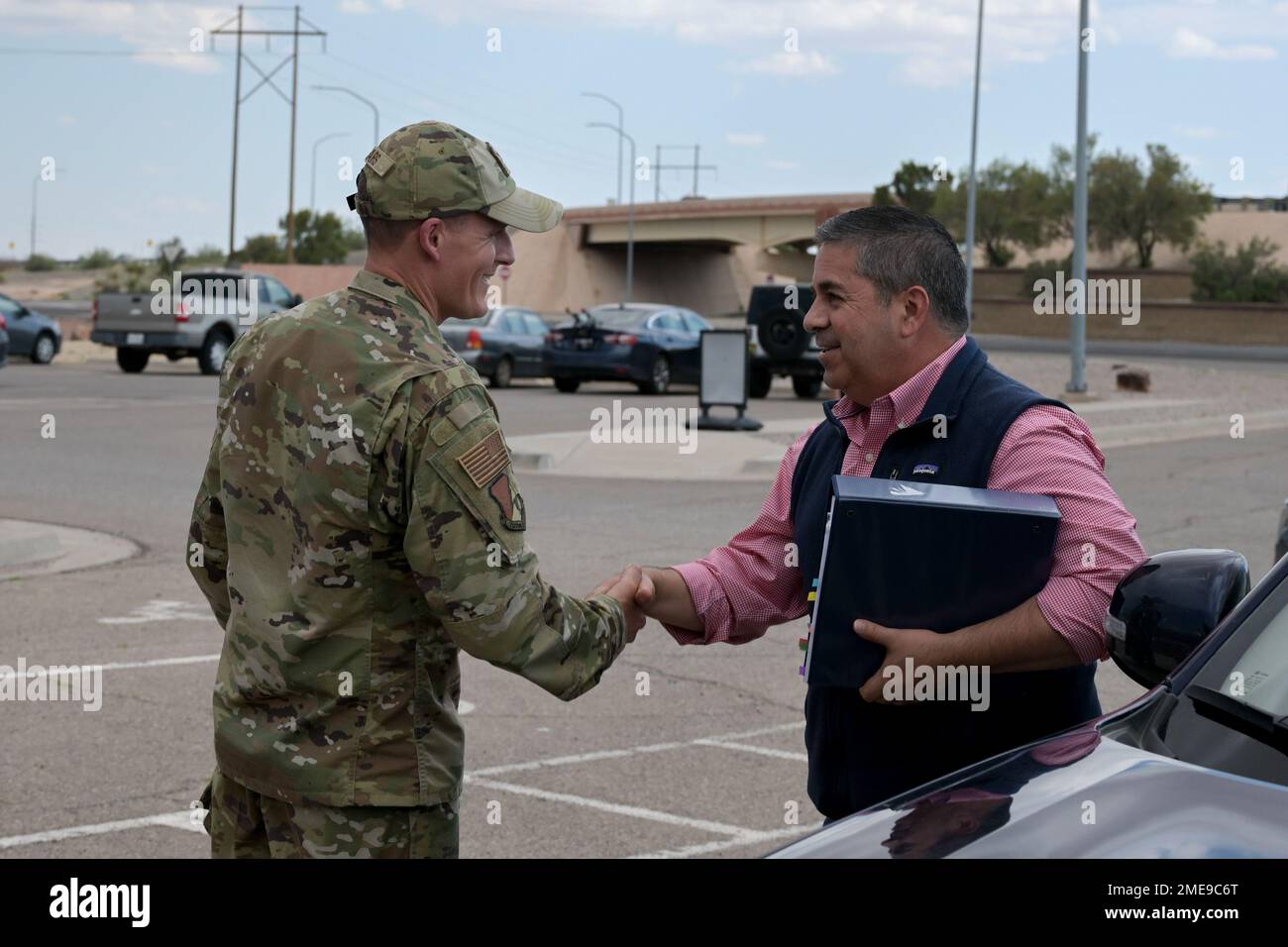 Col. Justin Spears, 49th Wing commander, greets Sen. Ben Ray Lujan as ...