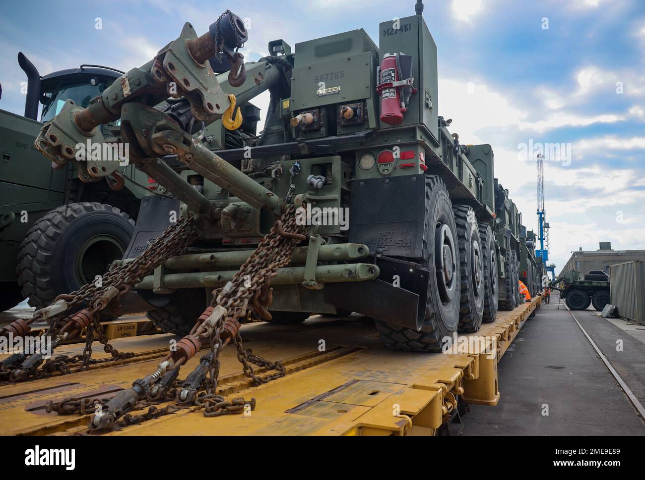 Tactical vehicles with Combat Logistics Regiment 27 are secured to rail ...