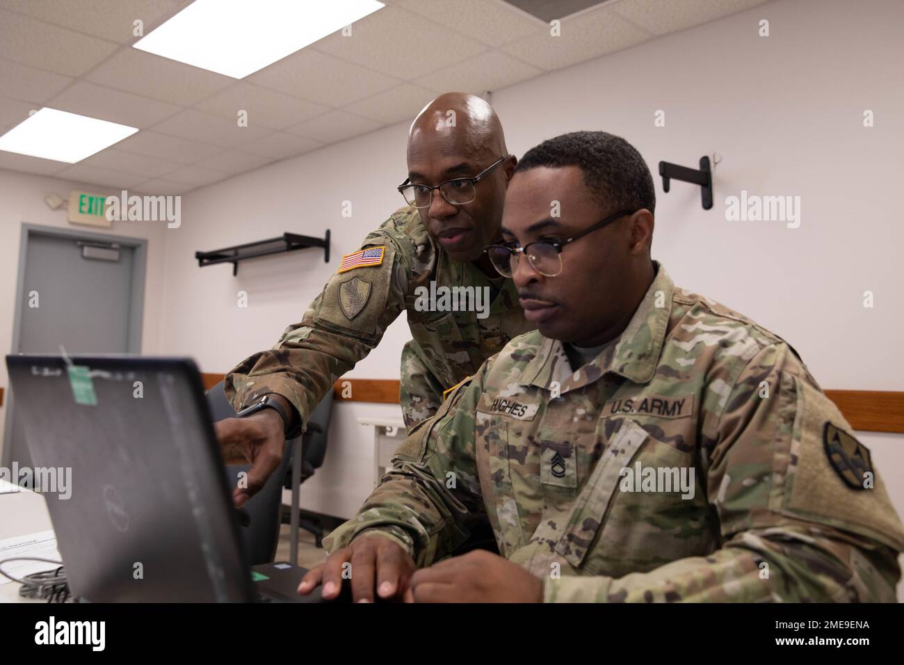 U.S. Army Reserve Maj. Daniel Cook (left) and Sgt. 1st Class Christian ...