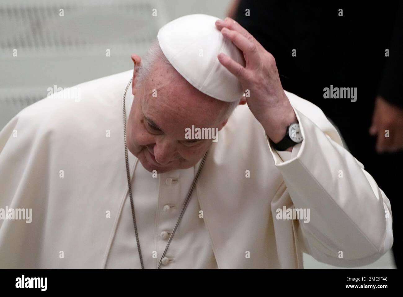 Pope Francis adjusts his skullcap during an audience with members of ...