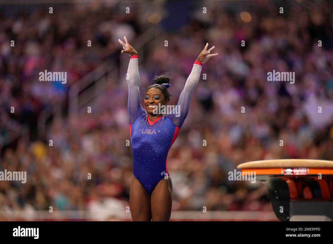 Simone Biles smiles after competing on the vault during the women's U.S ...