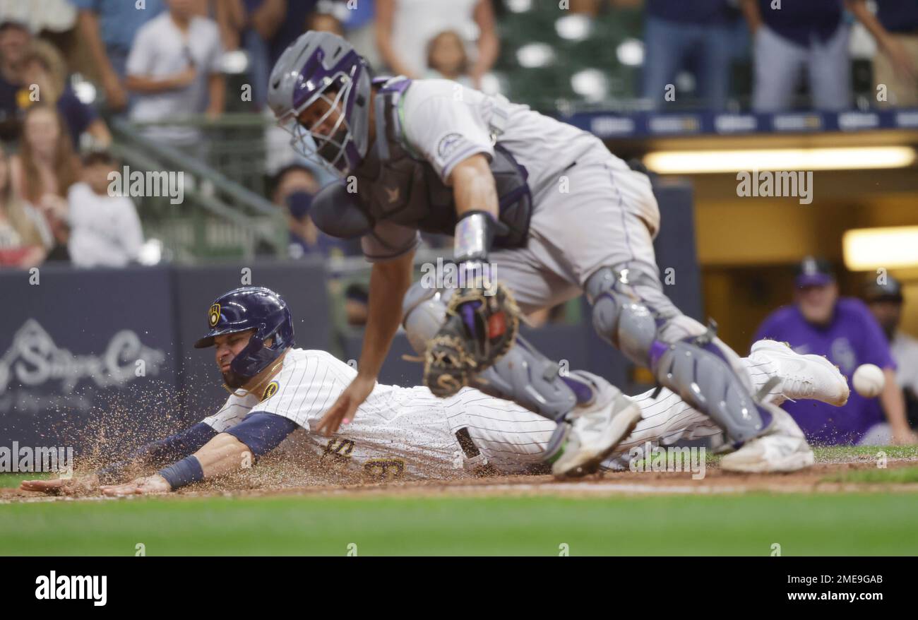 Milwaukee Brewers catcher Manny Pina (9) scores the winning run on a ...