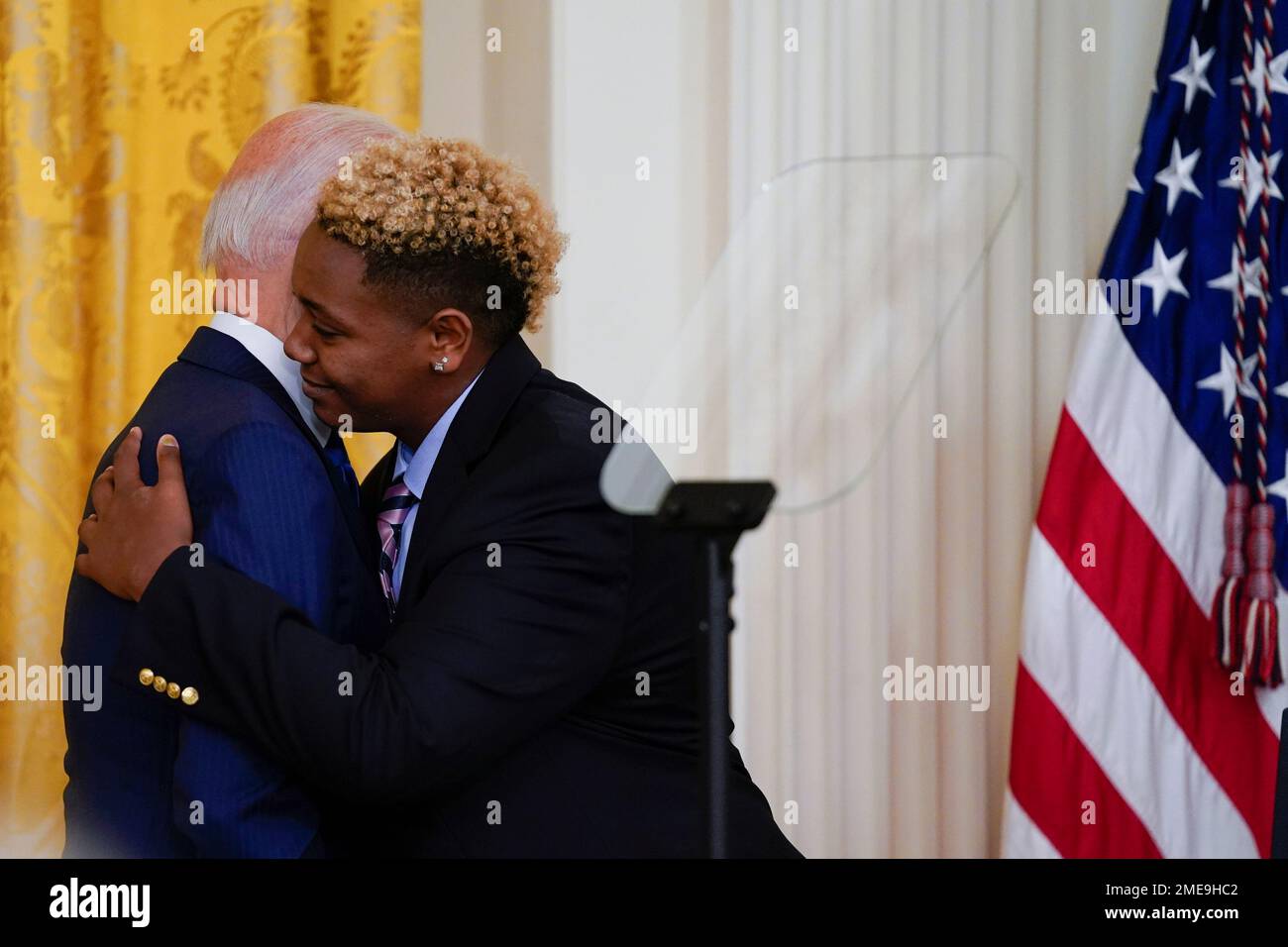 Ashton Mota, of the GenderCool Project, hugs President Joe Biden after ...