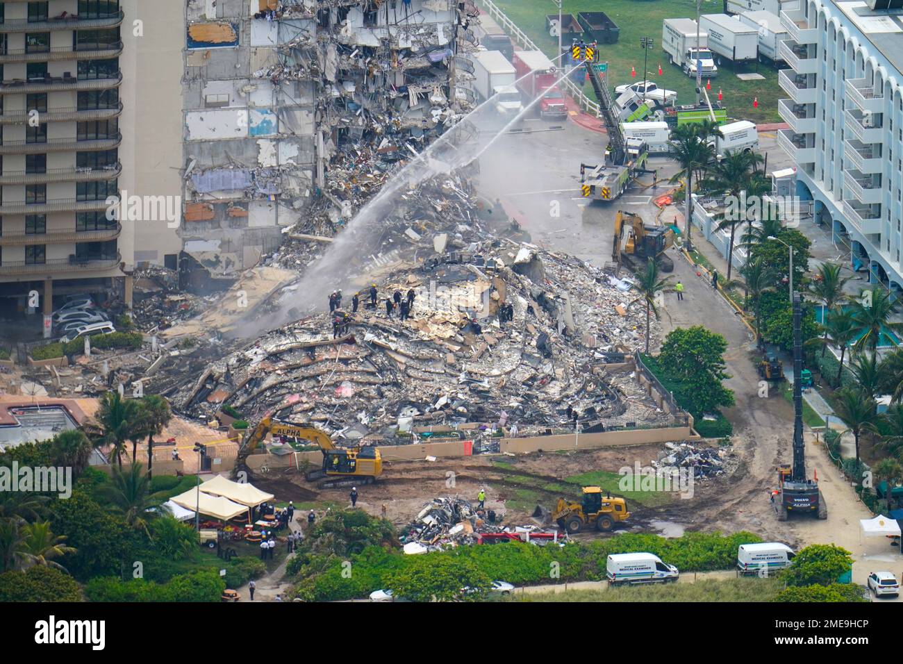 Rescue workers work in the rubble at the Champlain Towers South Condo ...