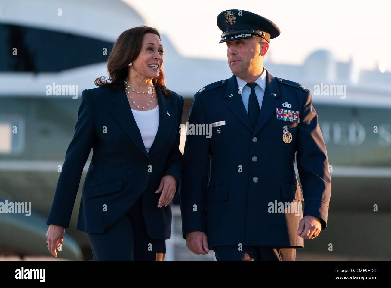 Vice President Kamala Harris walks with Lt. Col. Richard "Rick" Hulun ...