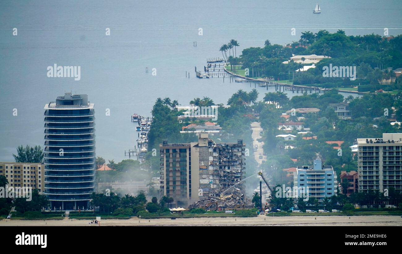 Rescue workers work in the rubble at the Champlain Towers South Condo ...