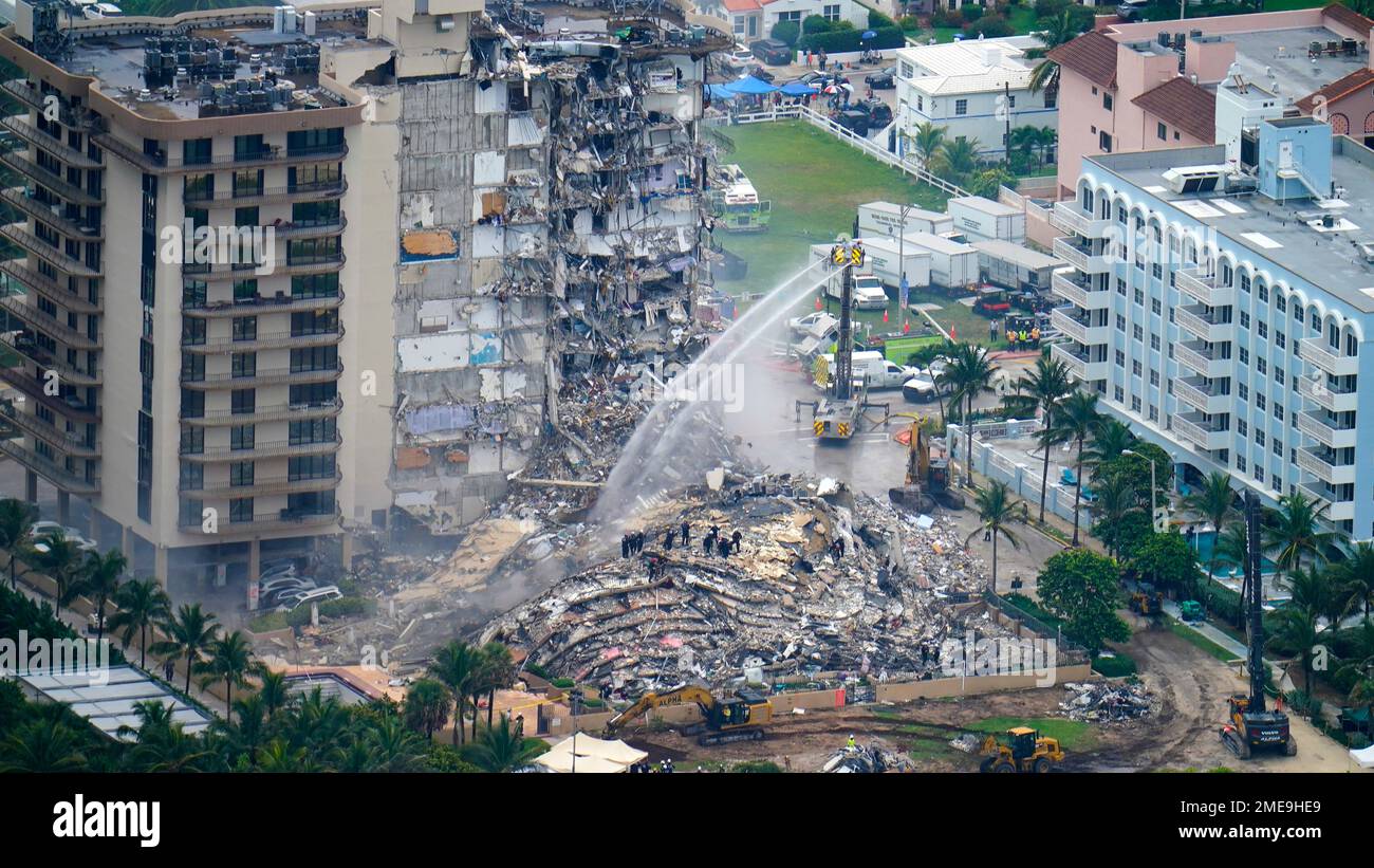 Rescue workers work in the rubble at the Champlain Towers South Condo ...