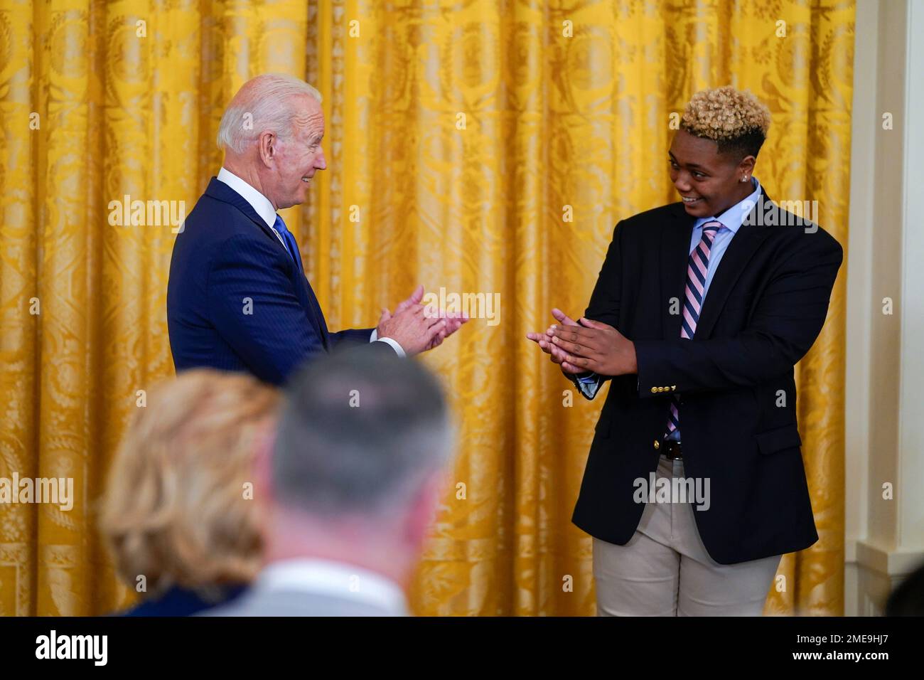 President Joe Biden applauds Ashton Mota of the GenderCool Project ...