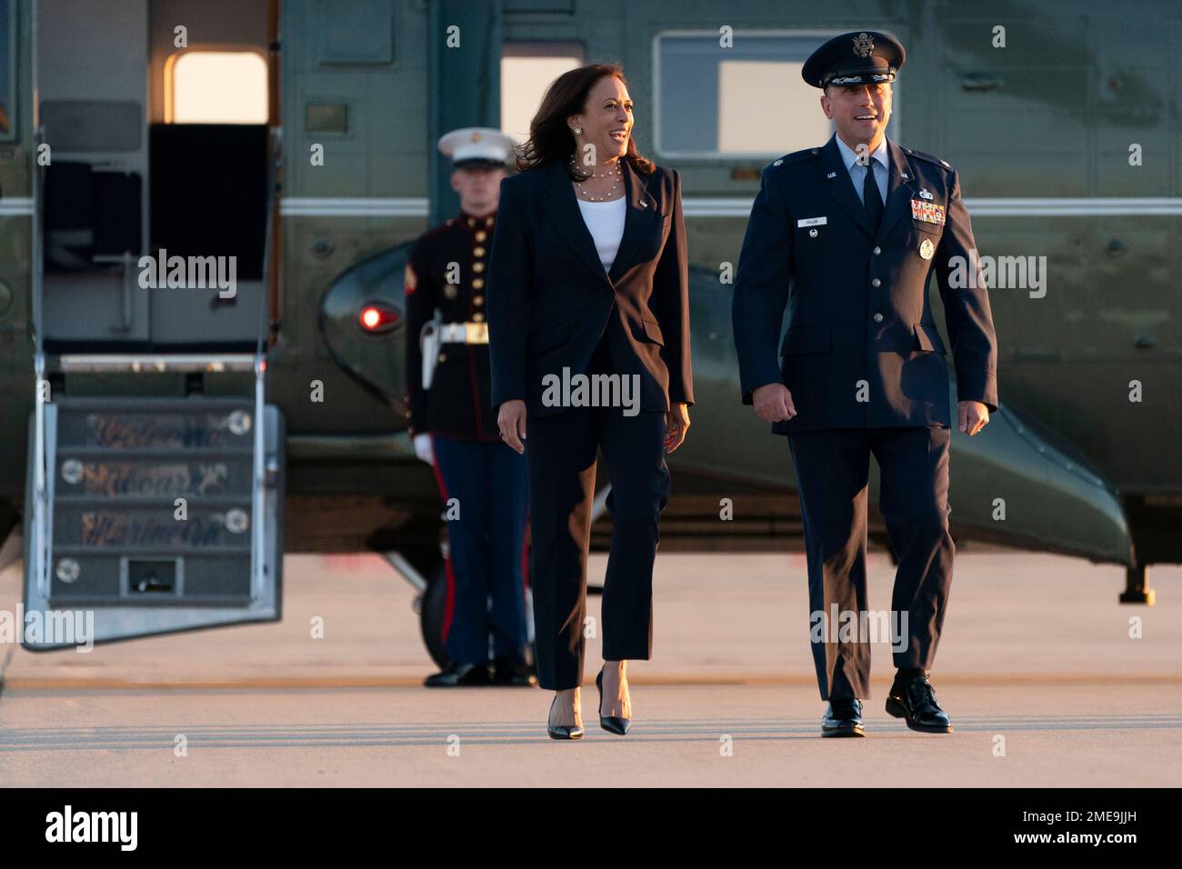 Vice President Kamala Harris, left, walks with Lt. Col Richard "Rick ...