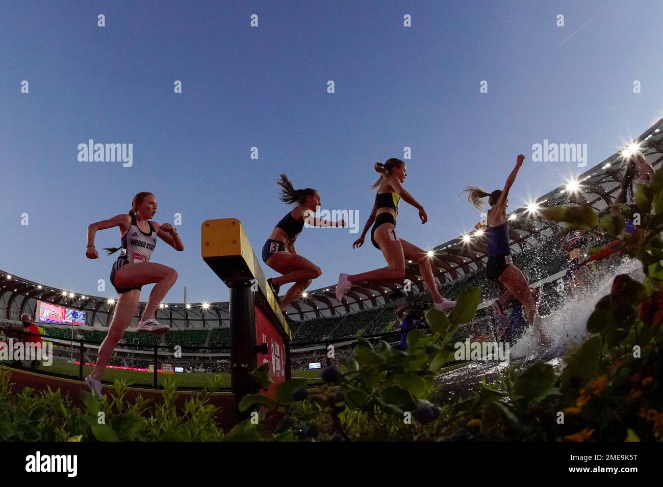 Runners compete in the women's 3000-meter steeplechase at the U.S ...