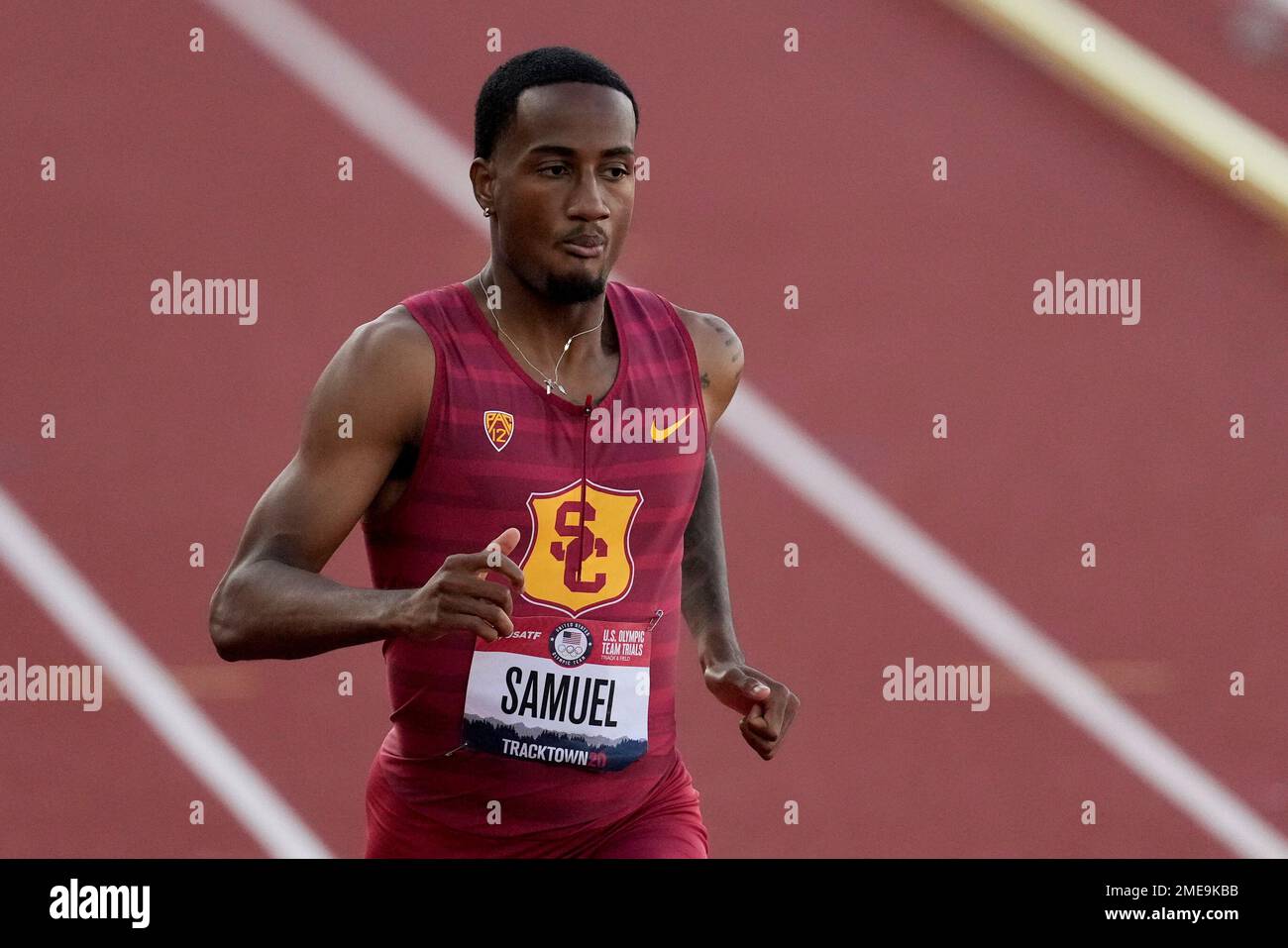 Cameron Samuel wins the fourth heat in the men's 400-meter hurdles at ...