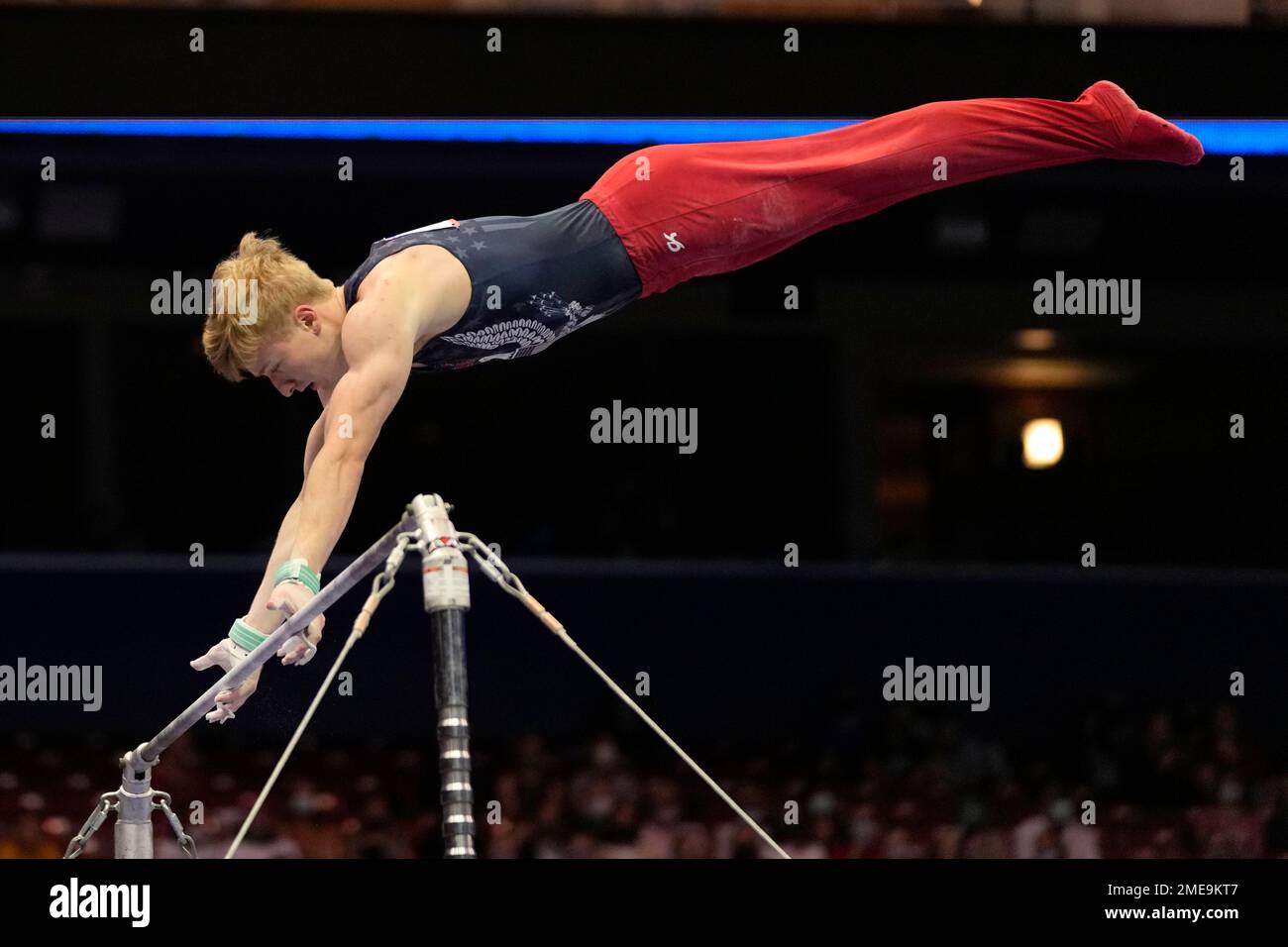 Riley Loos competes on the horizontal bar during the men's U.S. Olympic ...