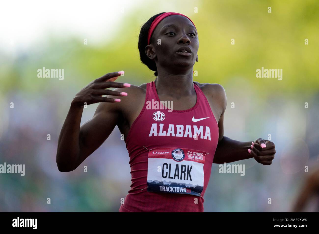 Tamara Clark, left, wins the fifth heat of the women's 200-meter run at ...
