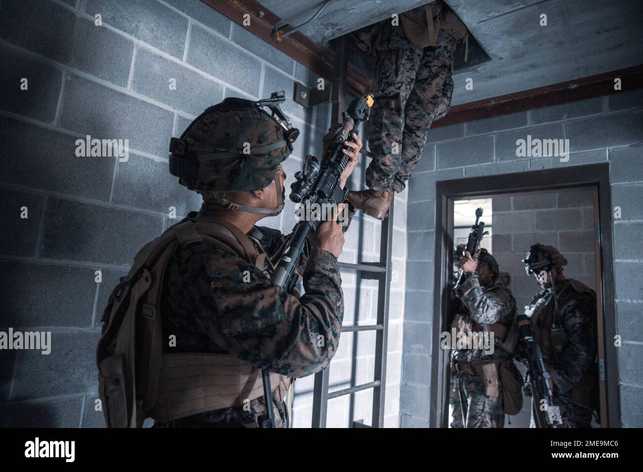 U.S. Marines with 1st Battalion, 8th Marine Regiment, 2d Marine Division, clear a building ...