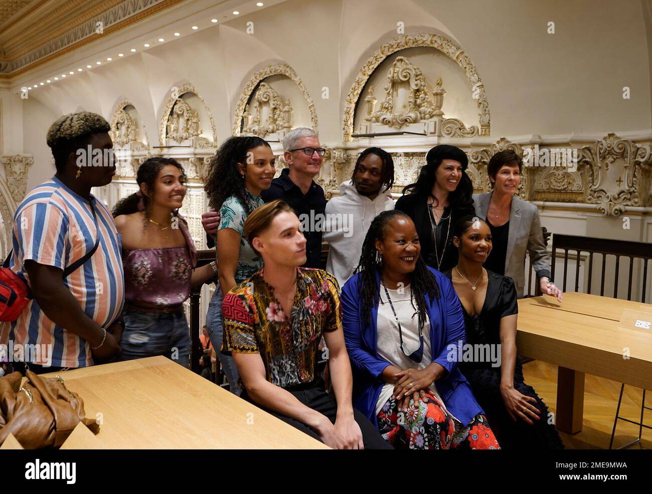 CORRECTS TO THEATRE-Apple CEO Tim Cook, standing middle, and Apple ...