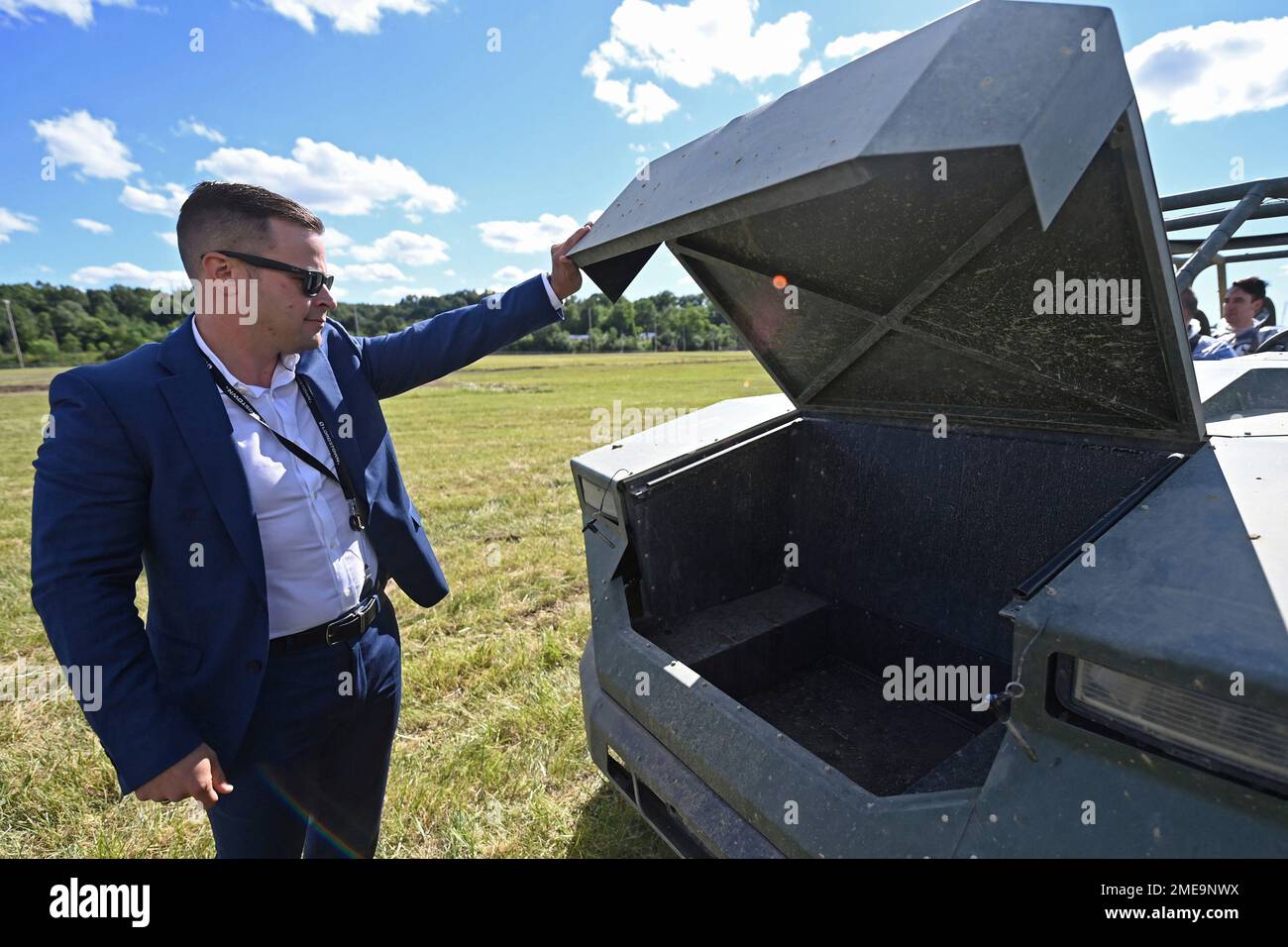 Lordstown Motors military liaison Tyler Streit shows off the frunk on ...