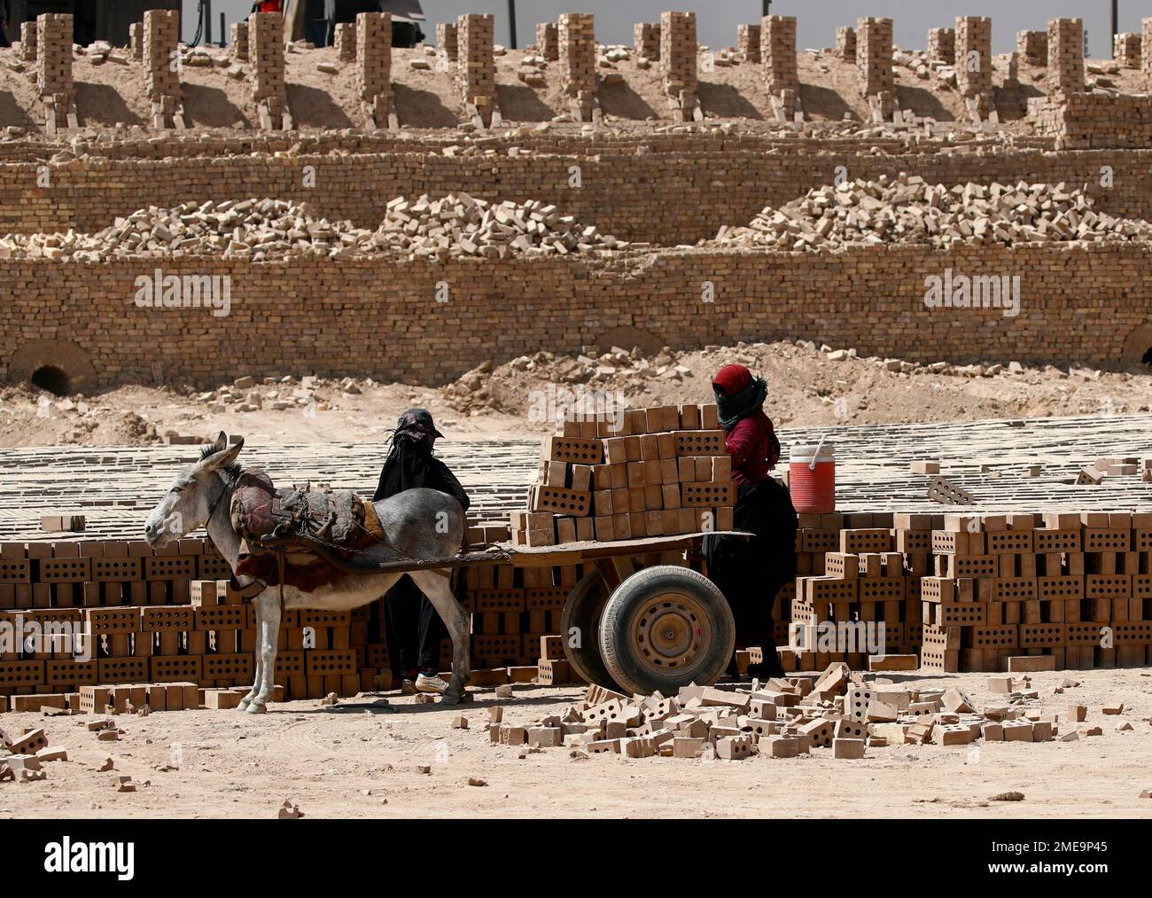 Women work at a brick factory in a brick factory in Baghdad's southeast ...