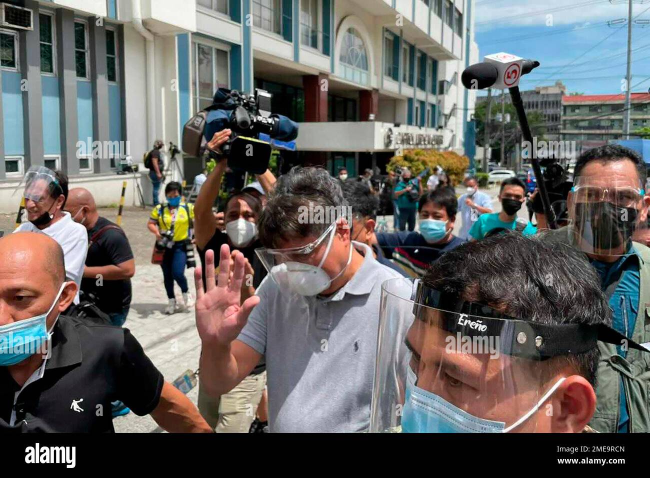 Former senator Francis “Kiko” Pangilinan, center, leaves Capitol Medical Center where former ...