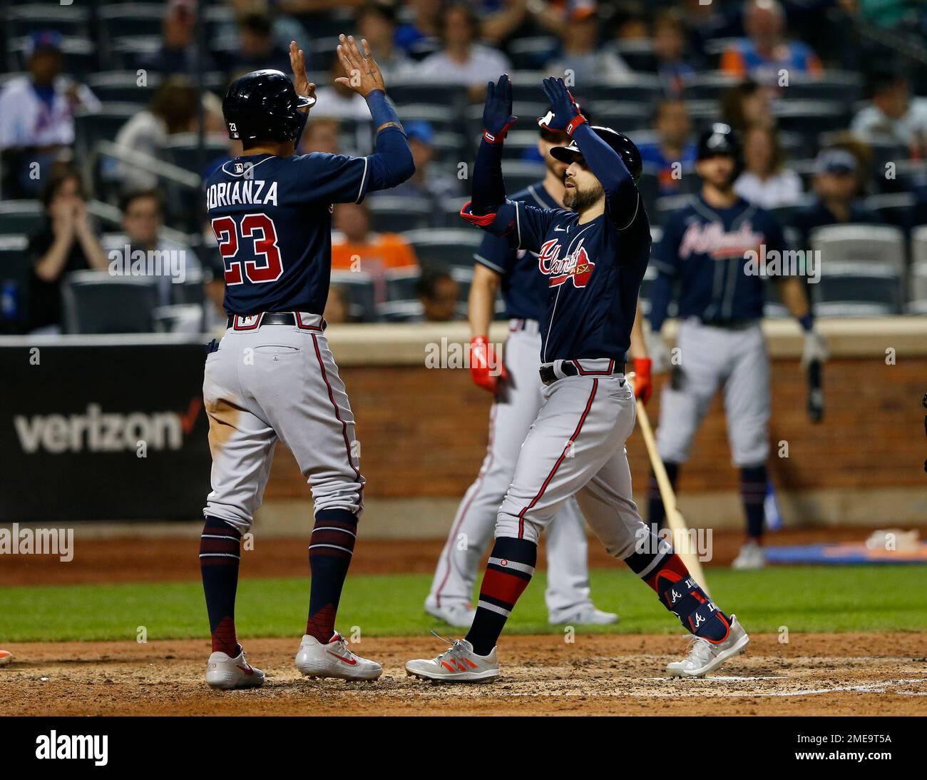 Atlanta Braves center fielder Ender Inciarte (11) and third baseman Ehire Adrianza (23 ...