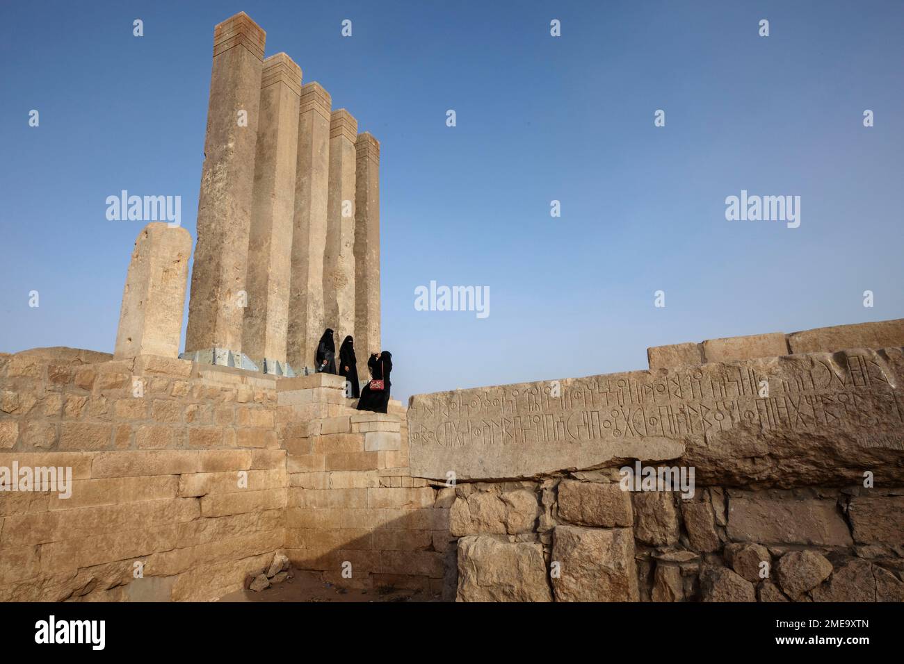 Woman take photographs at Awwam Temple, also known as the Mahram Bilqis ...