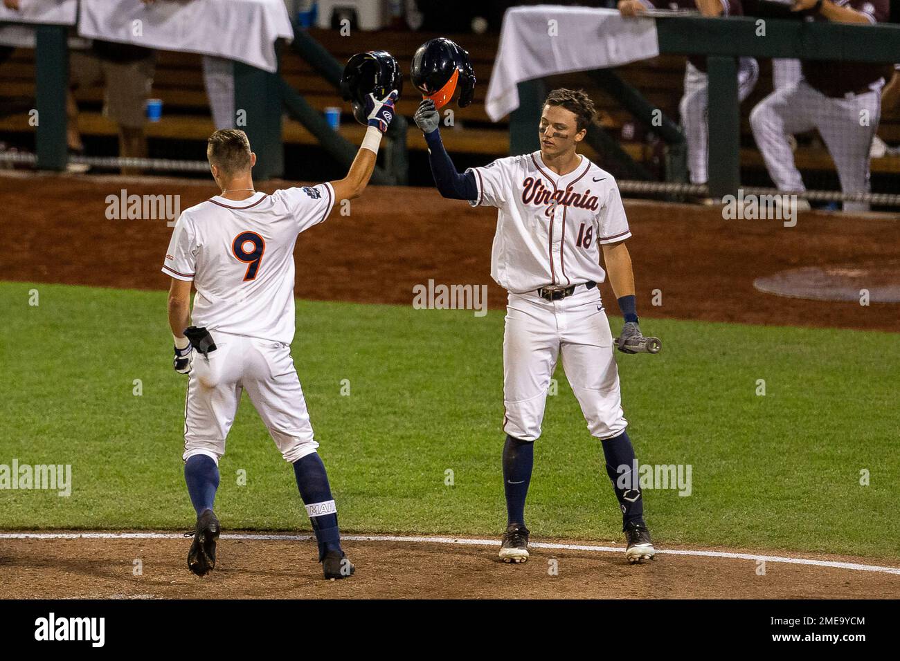 Virginia outfielder Chris Newell (9) celebrates his home run with Zack ...