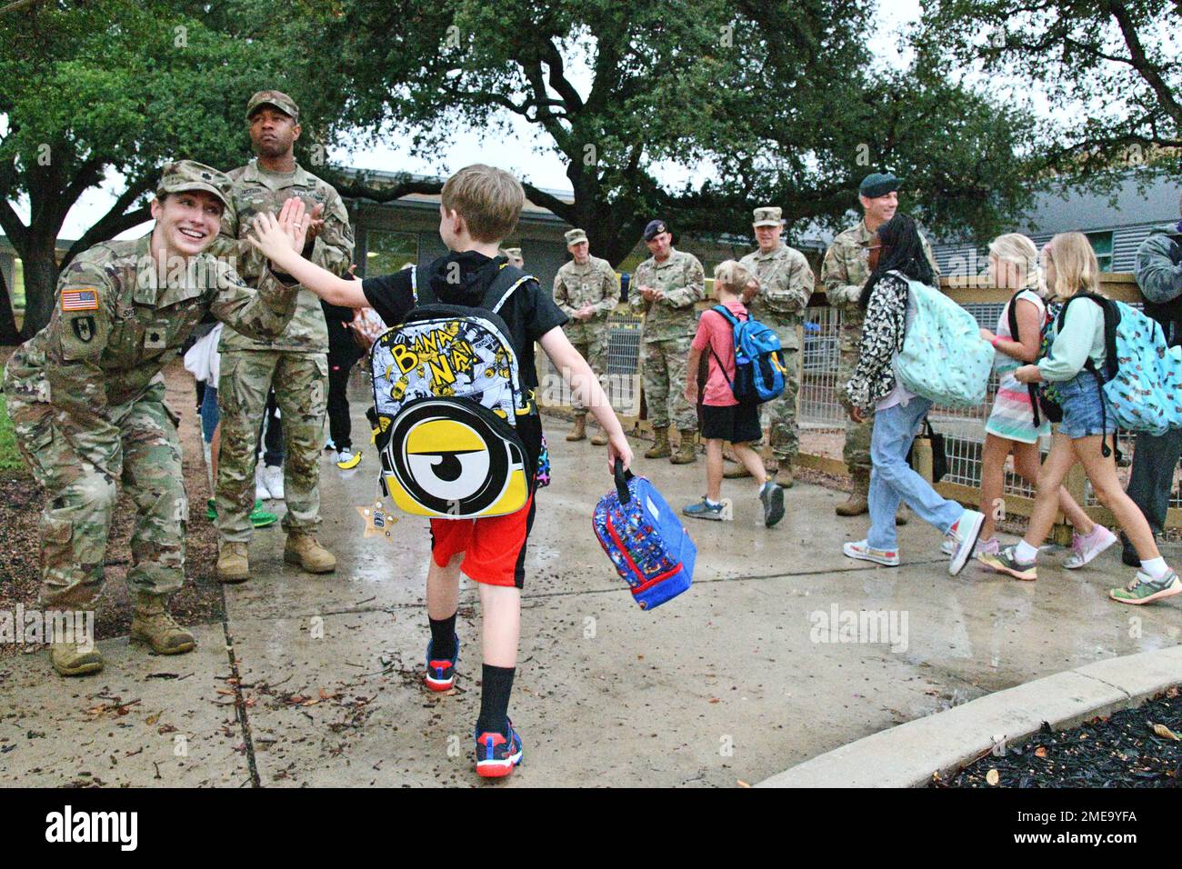 Giving a student a high five, Lt. Col. Genna Speed, commander 232d ...