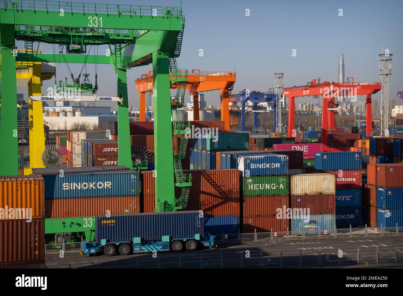 A driverless truck moves a shipping container at a port in Tianjin ...