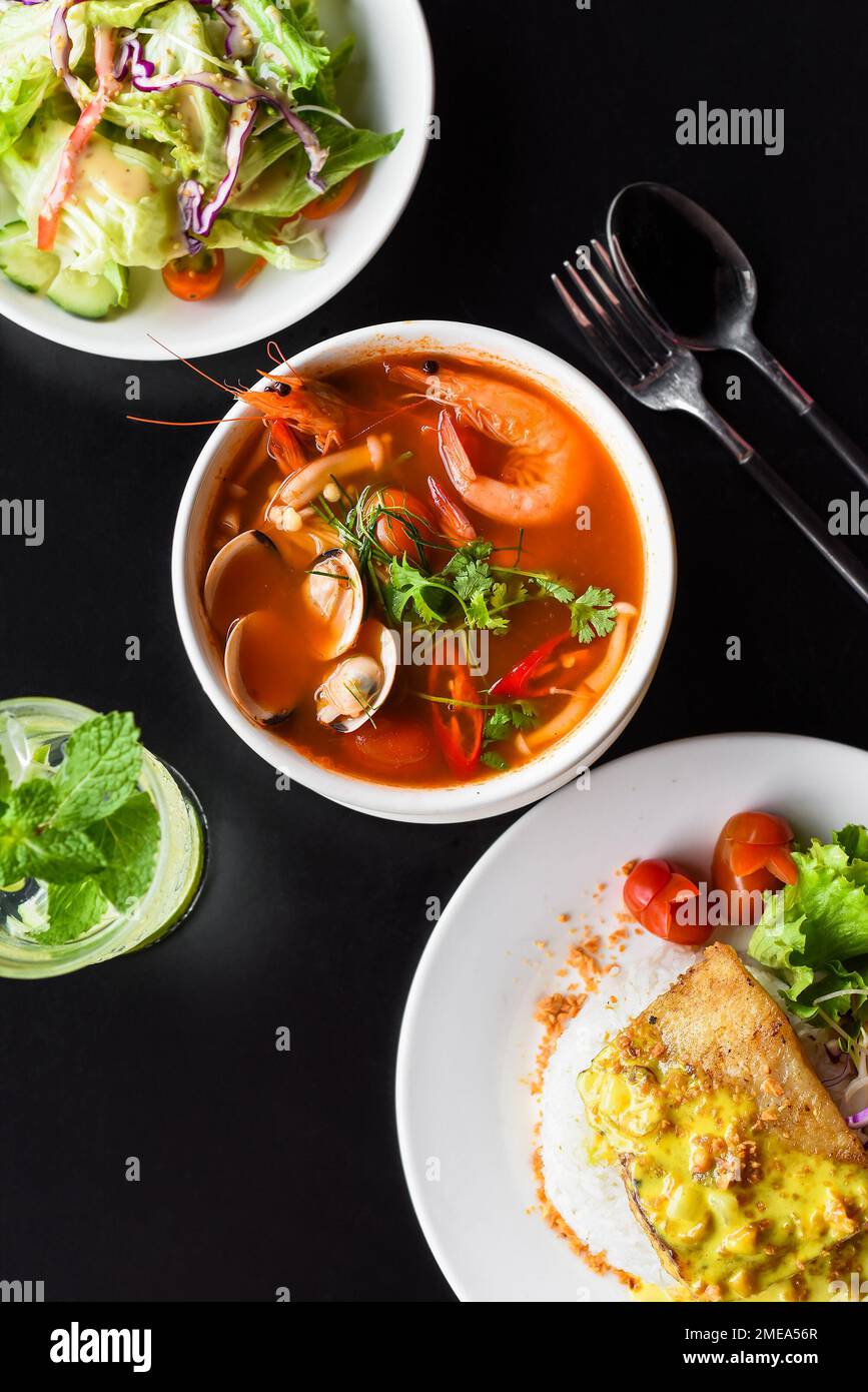 Lunch set made of tom yum soup, salad, grilled basa fish, rice, on ...