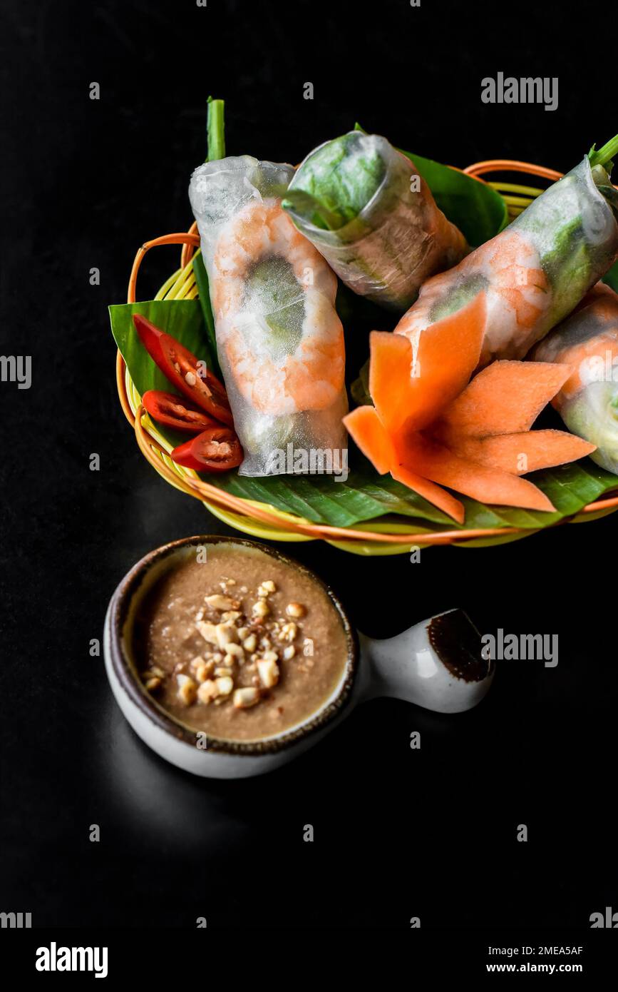 Traditional vietnamese spring rolls with shrimps, rice paper on black ...