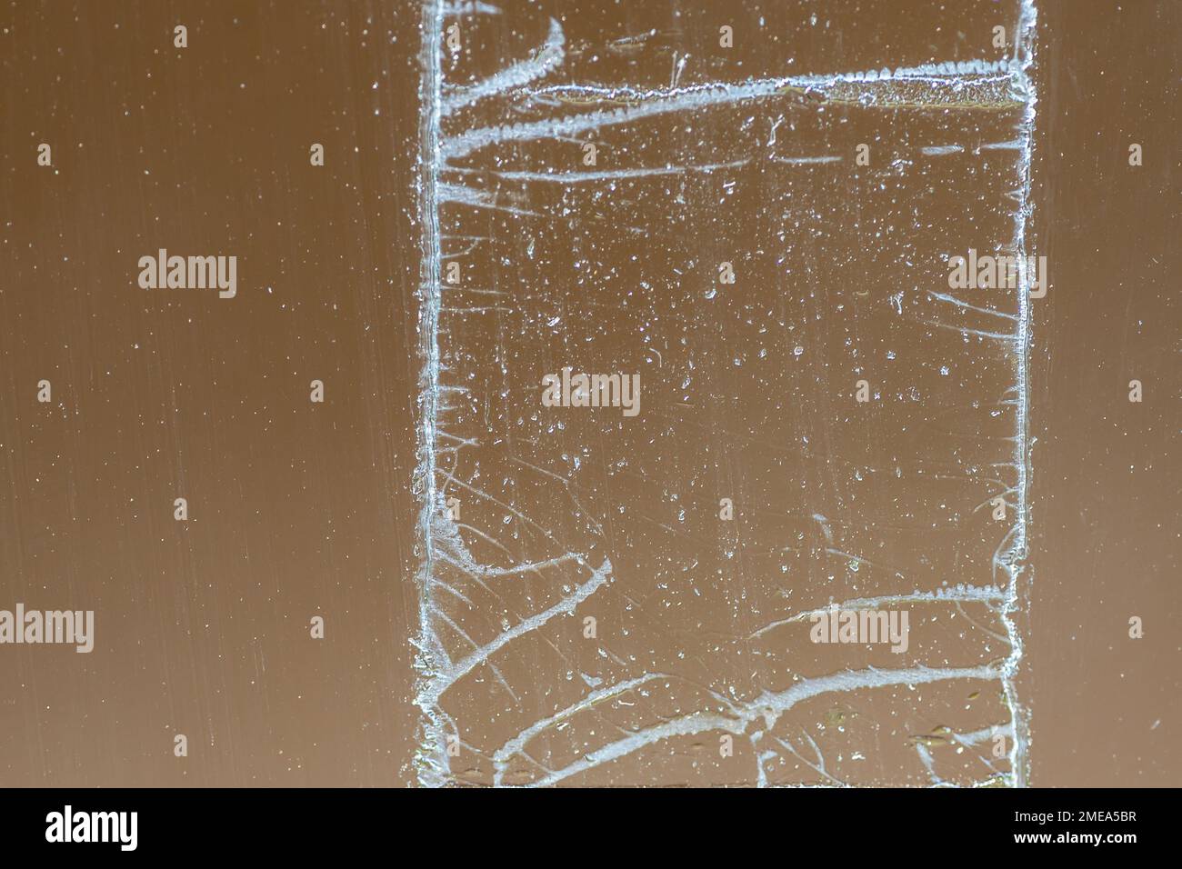 Strip of tape adhesive on a glass surface after being pulled Stock ...