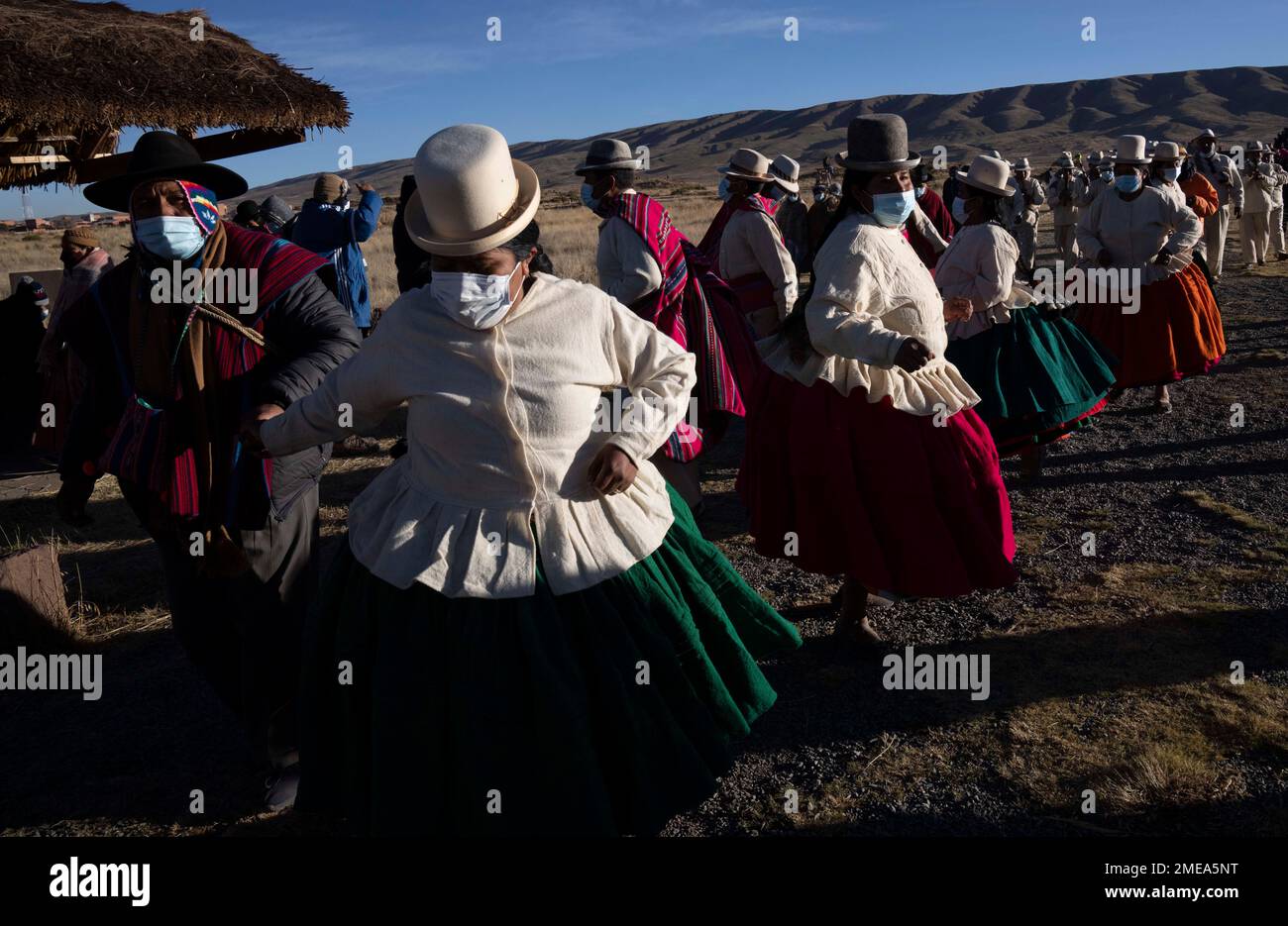 Aymara Indigenous people dance after receiving the first rays of ...