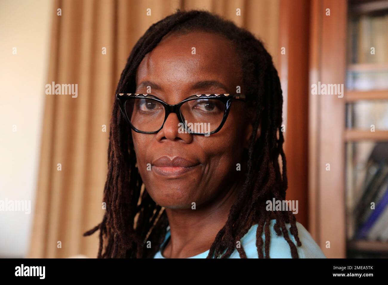 Zimbabwea author Tsitsi Dangarembwa poses for a photograph at her home ...