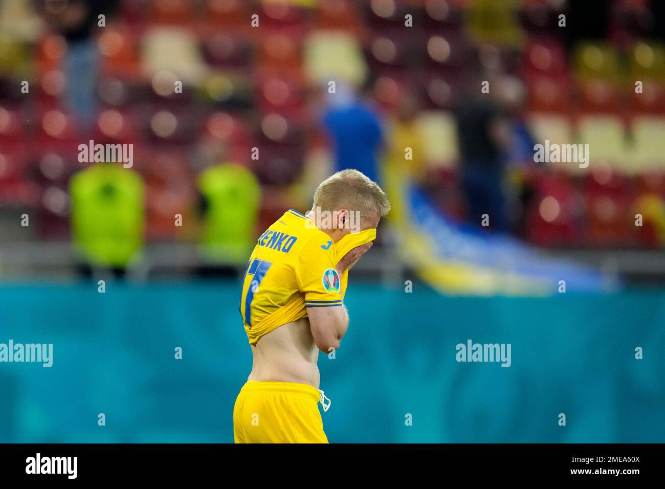Ukraine's Oleksandr Zinchenko covers his face after the Euro 2020 ...