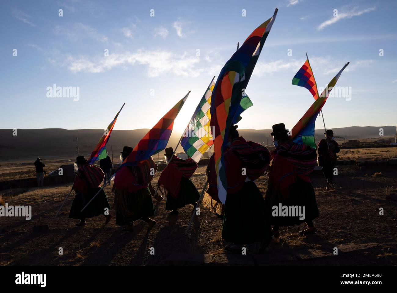 Aymara Indigenous women carry Wiphala flags, which represent the Andean ...