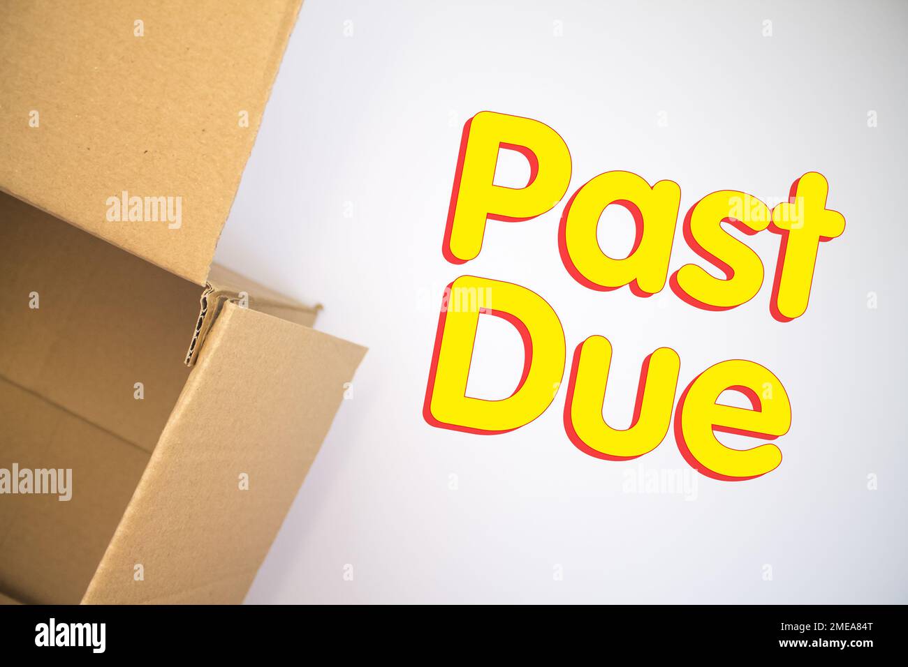 Past Due word with cardboard box. Brown folded card box Stock Photo - Alamy