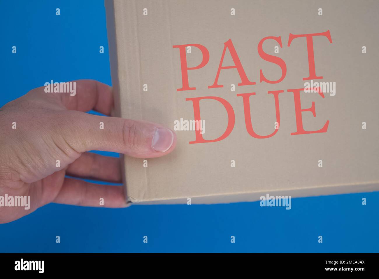 Past Due word with cardboard box. Brown folded card box Stock Photo - Alamy