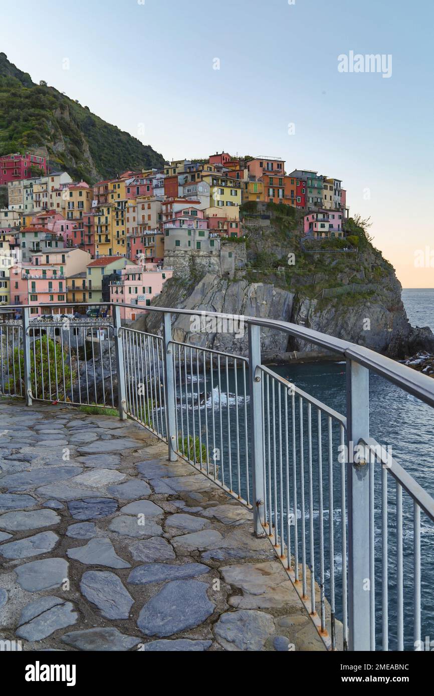 Stone pathway leading towards the coastal cliffside village of Manarola ...