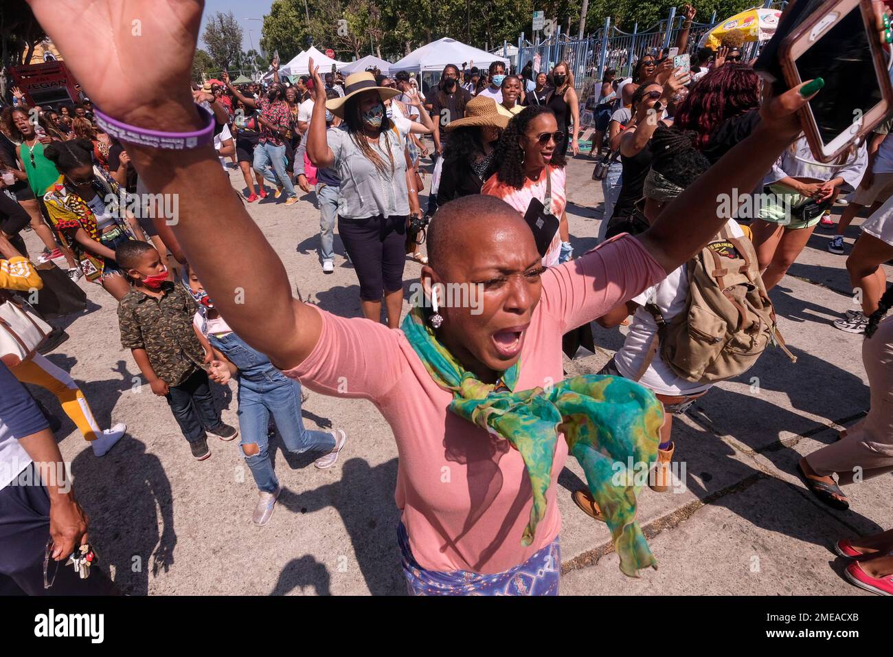 People dance as they celebrate during a Juneteenth commemoration at ...