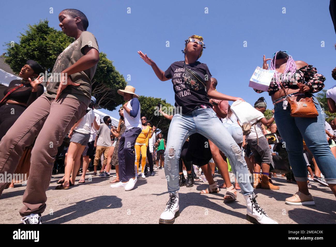 People dance as they celebrate during a Juneteenth commemoration at ...