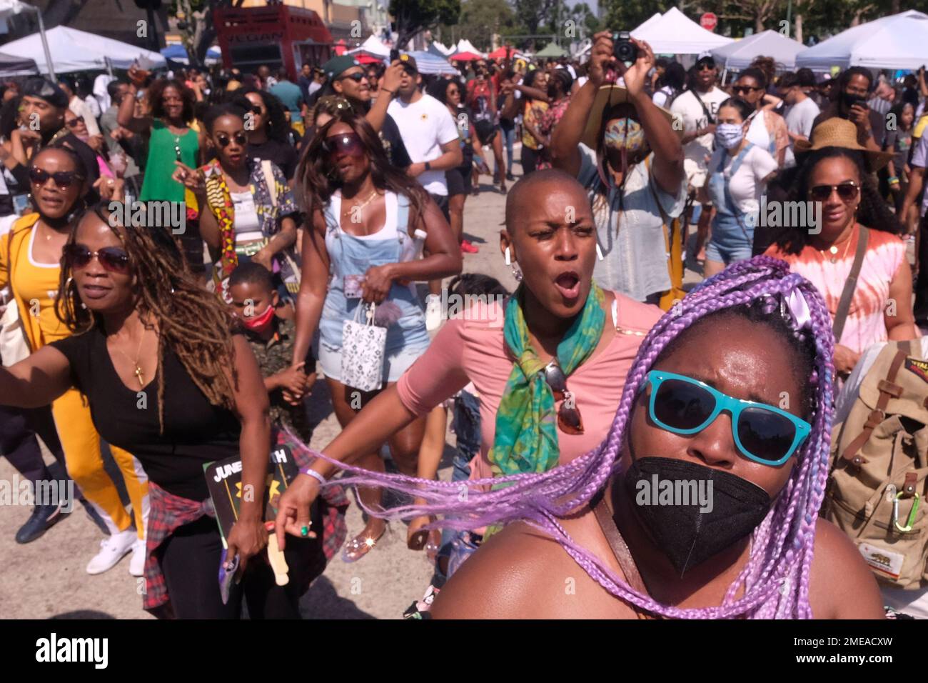 People dance as they celebrate during a Juneteenth commemoration at ...