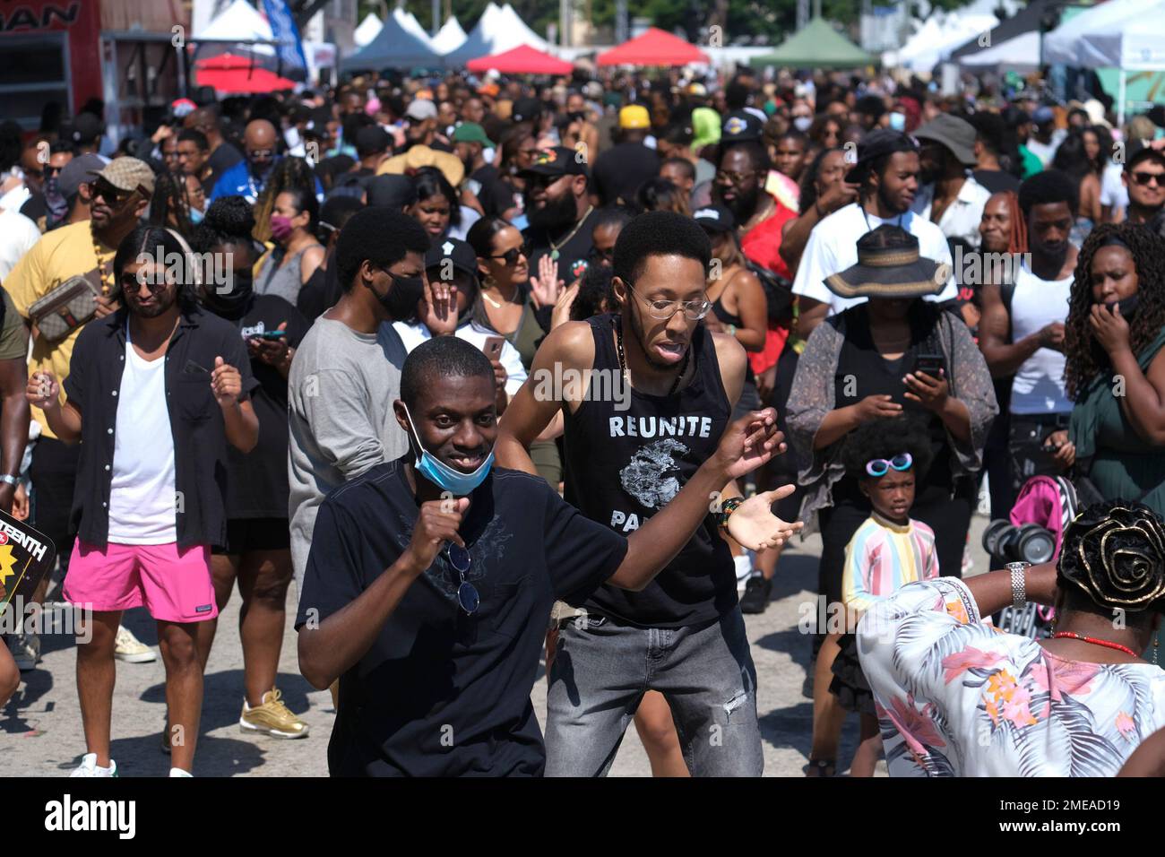 People dance as they celebrate during a Juneteenth commemoration at ...