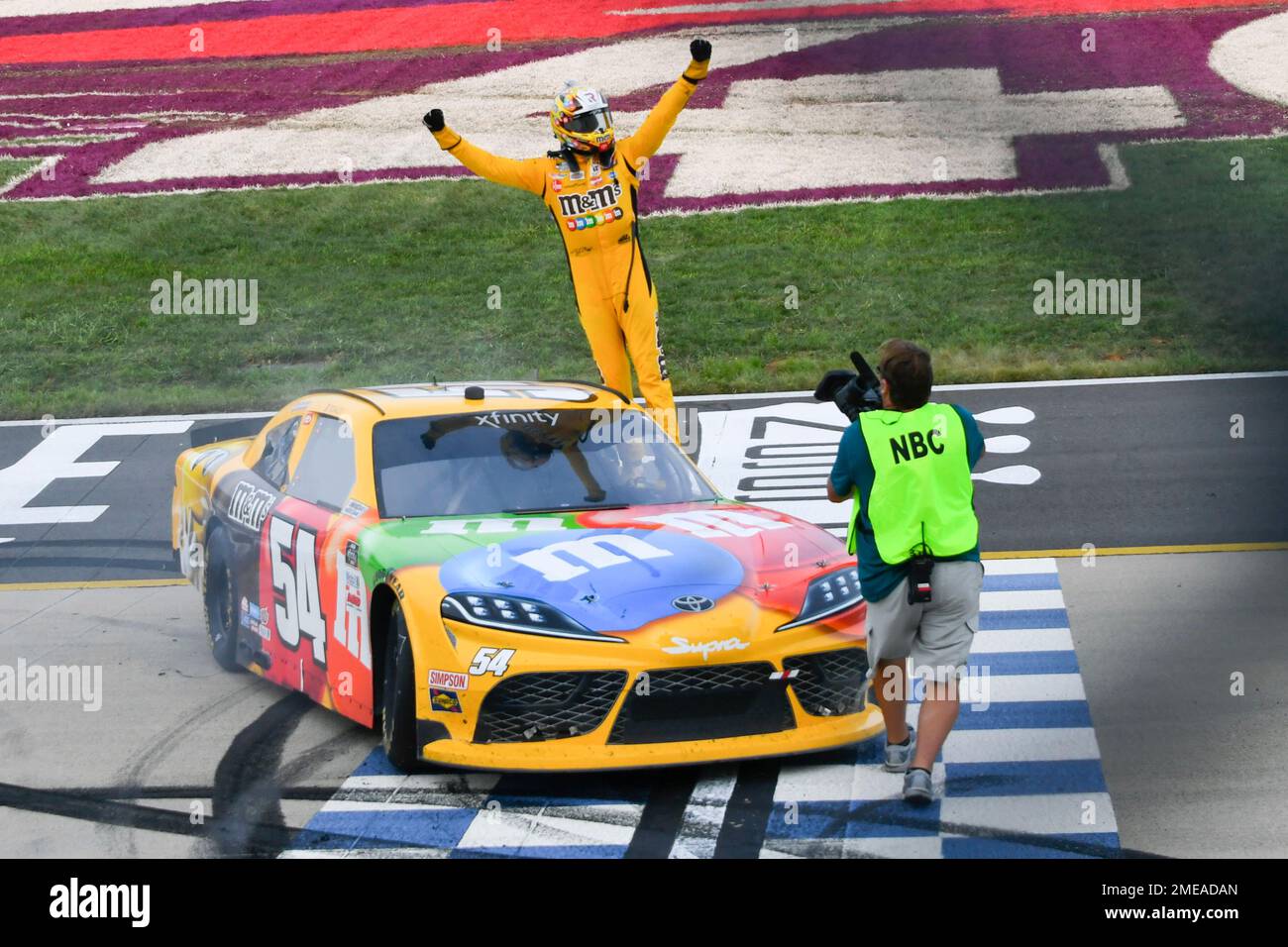 Kyle Busch celebrates at the finish line after winning a NASCAR Xfinity ...