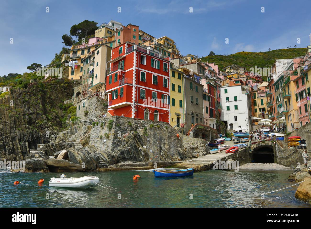 View of colourful buildings in the coastal village of Riomaggiore in ...