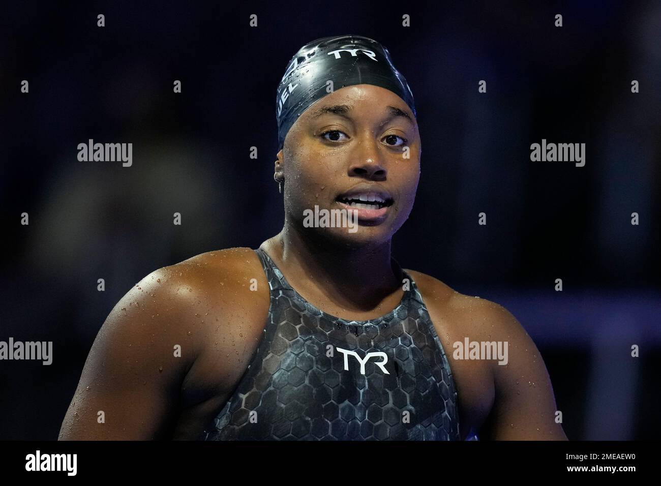 Simone Manuel walks on the pool deck after competing in a women's 50 ...