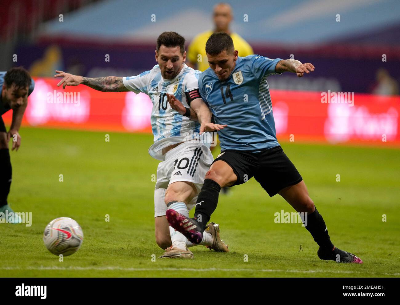 Argentina's Lionel Messi, left, and Uruguay's Lucas Torreira battle for ...