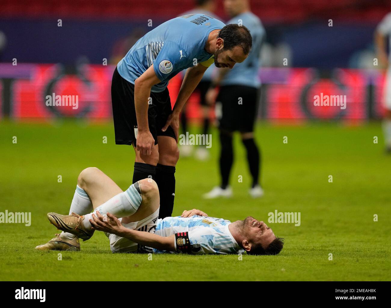 Argentina's Lionel Messi lays on the ground in pain during a Copa ...