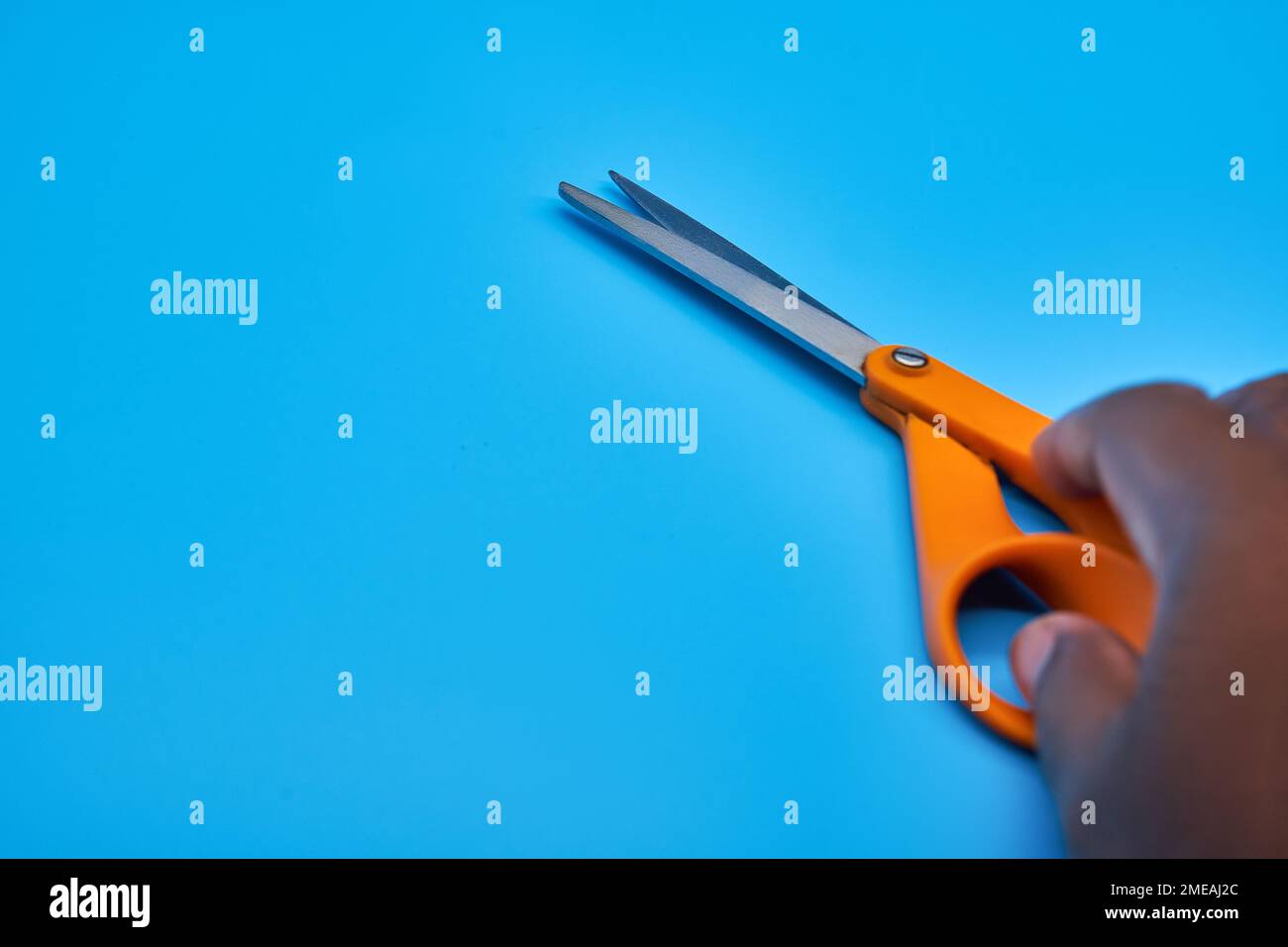 Orange shear scissors on a light blue background cutting shears baby ...