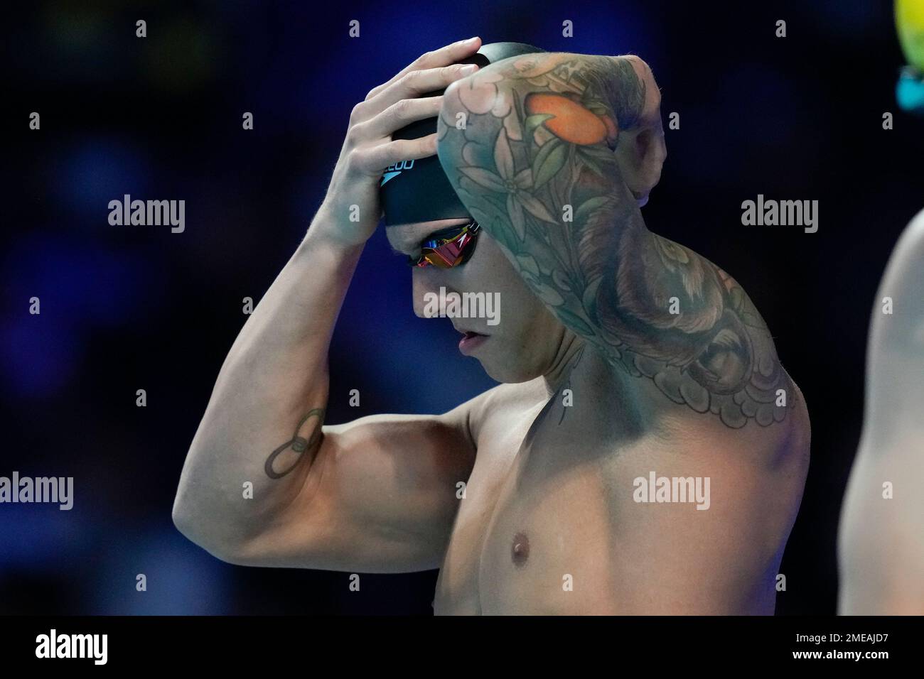 Caeleb Dressel gets ready for the start of the men's 100-meter ...
