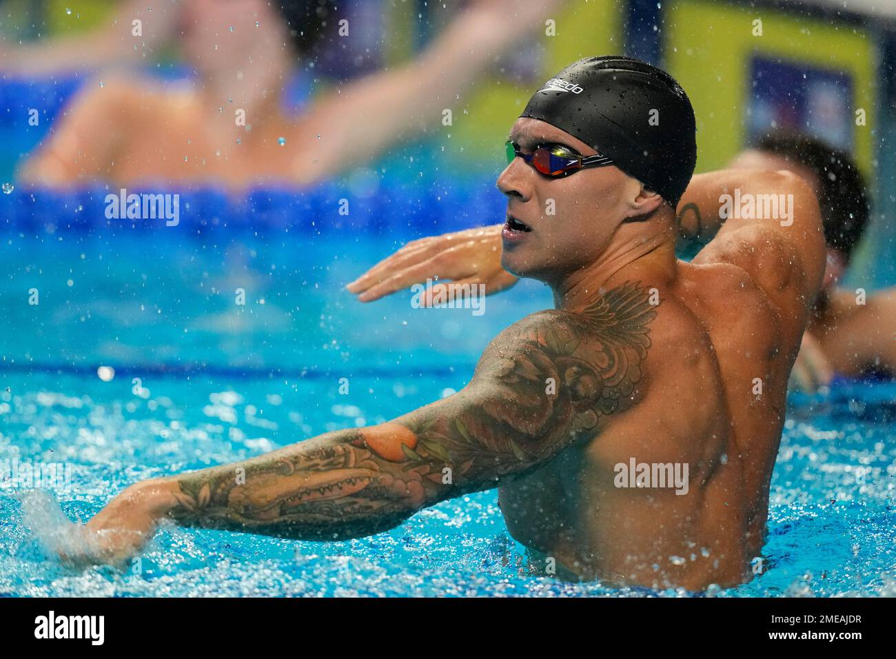 Caeleb Dressel celebrates after winning the men's 100-meter freestyle ...